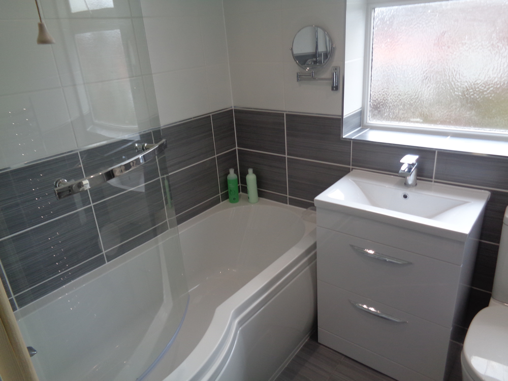 A Bathroom Refitted Including Storage Draw Sink Unit